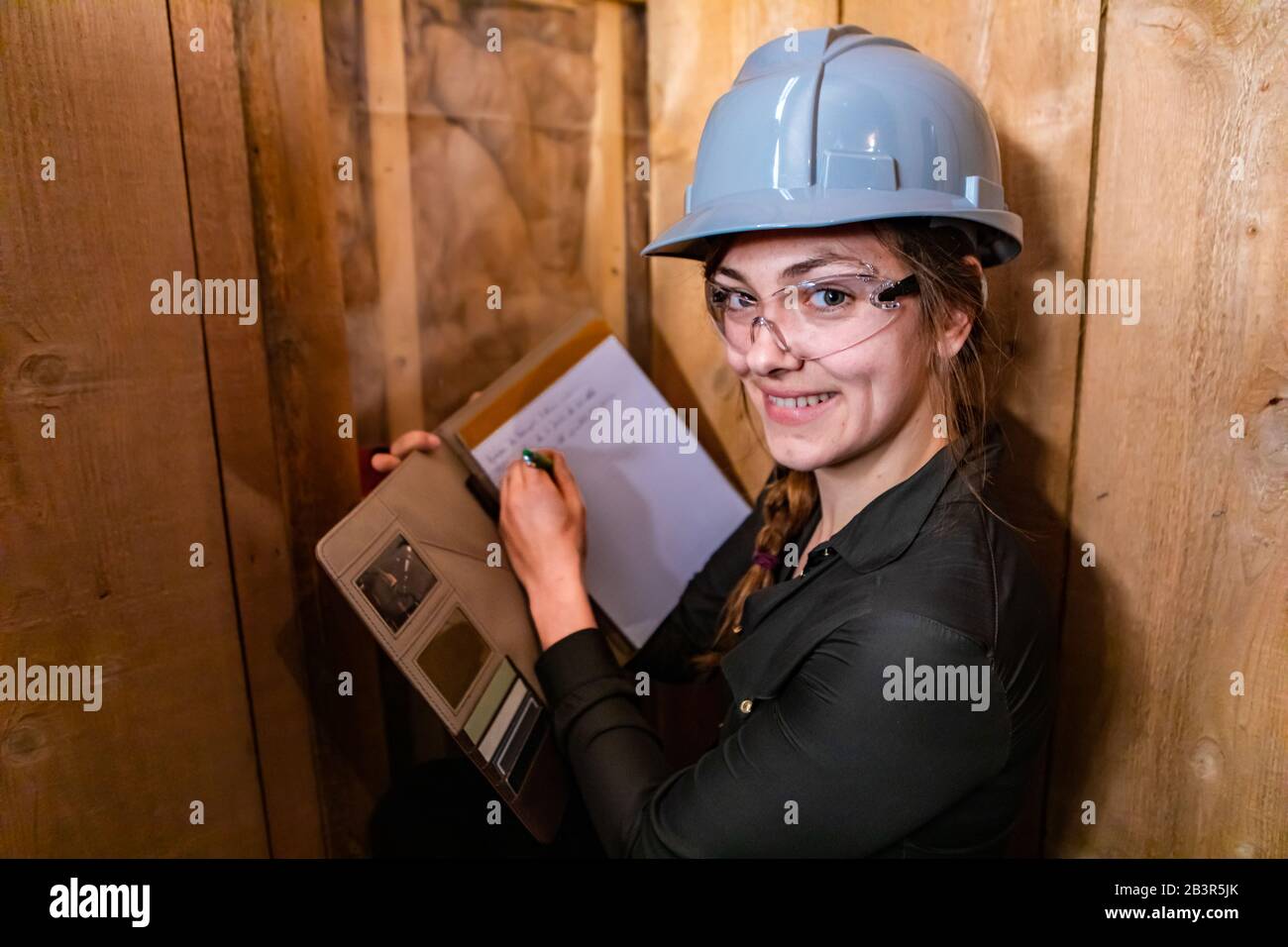 Indoor air quality inspector woman looking for molds or fungi problems ...