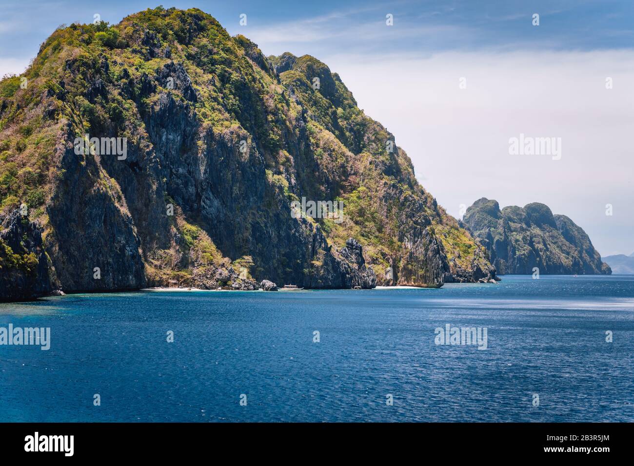 Limestone karst mountains of Matinloc Island. El Nido, Palawan ...