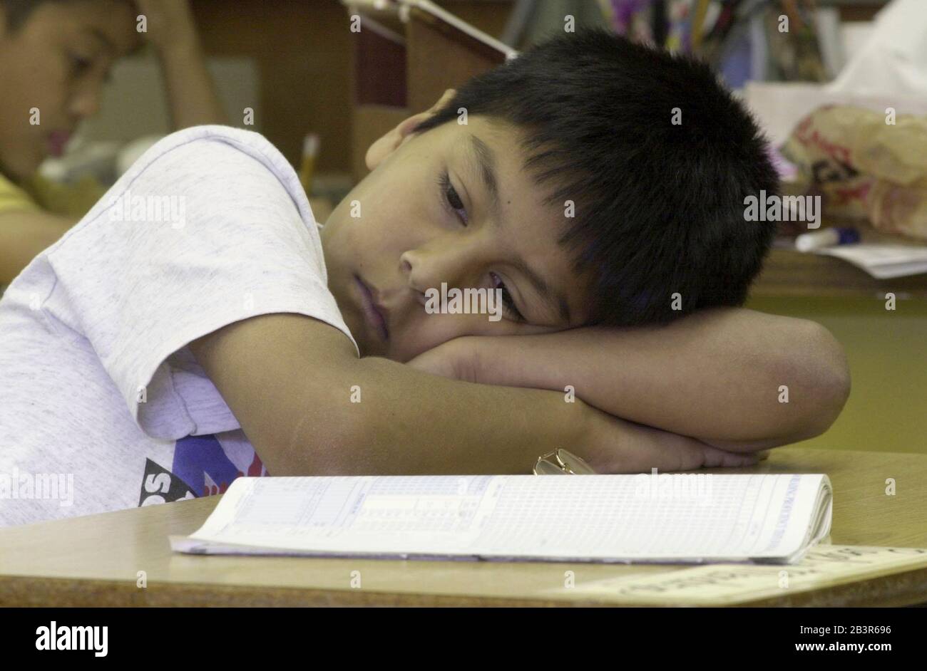Boy students taking test in classroom hi-res stock photography and ...