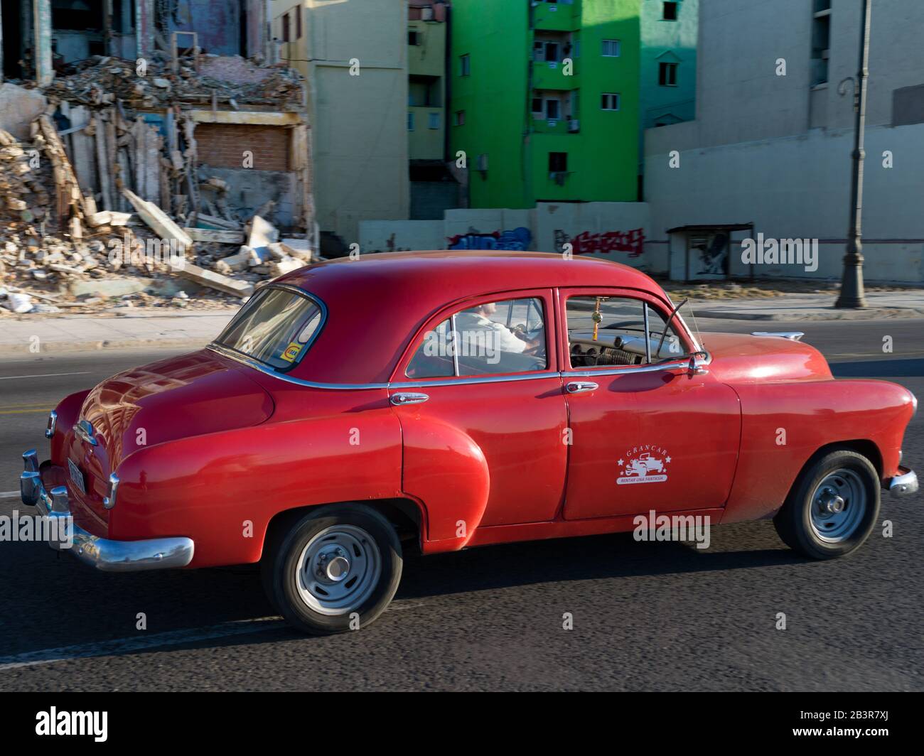Car going down the road, Malecon, Havana, Cuba Stock Photo - Alamy