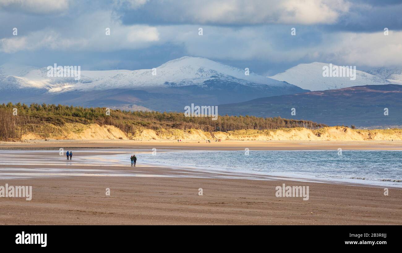 The snow covered mountains of Snowdonia and the sand dunes of ...