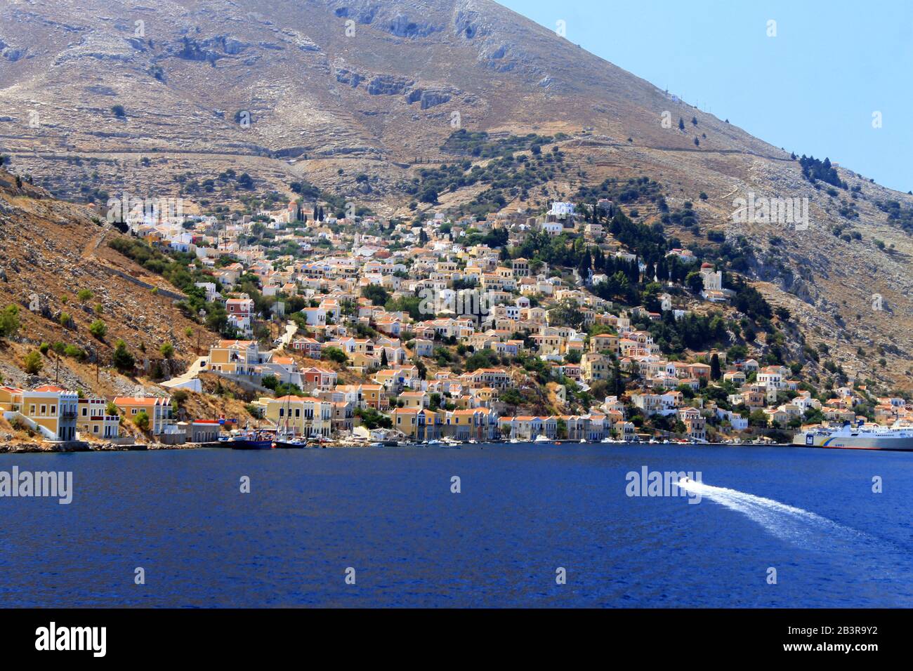 Colored and typical Simi island in Greece Stock Photo - Alamy