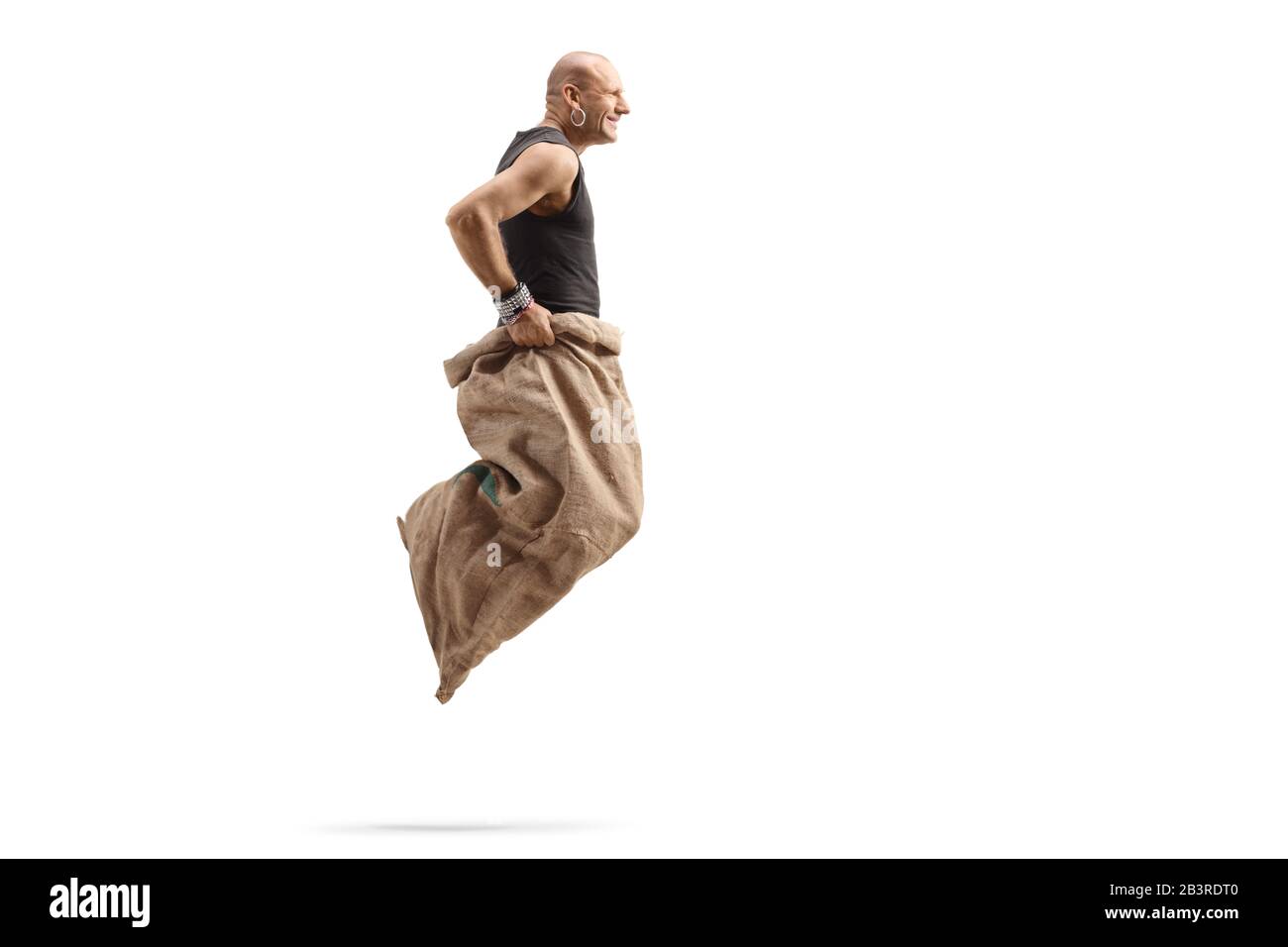 Smiling man jumping in a sack isolated on white background Stock Photo ...
