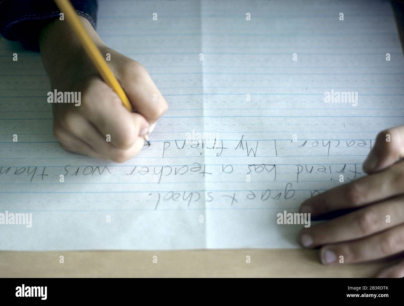Austin, Texas: Second grader writing for English lesson. ©Bob Daemmrich ...