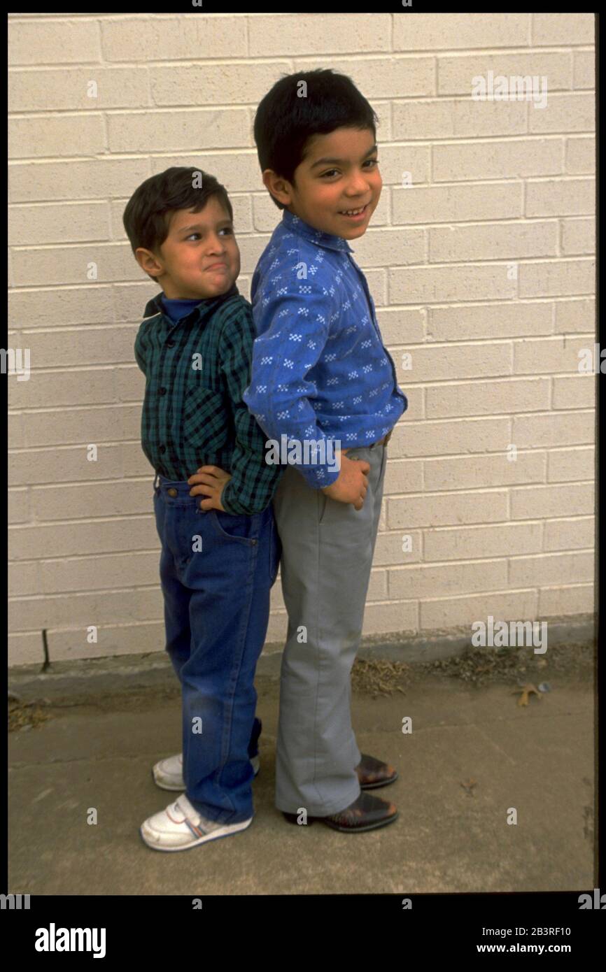 Comparing height back to back hi-res stock photography and images - Alamy