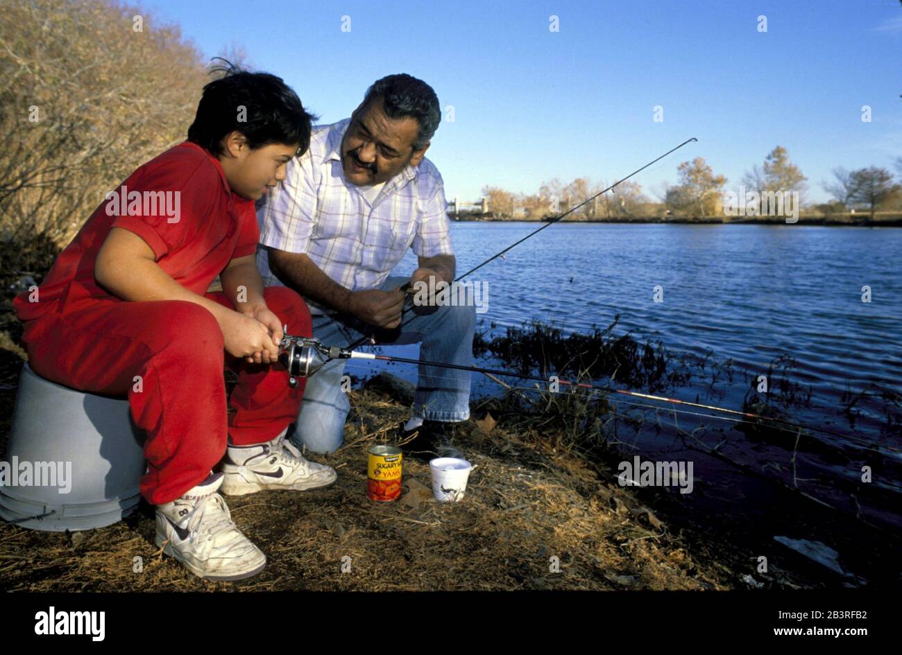 Man grandson fishing poles hi-res stock photography and images - Alamy