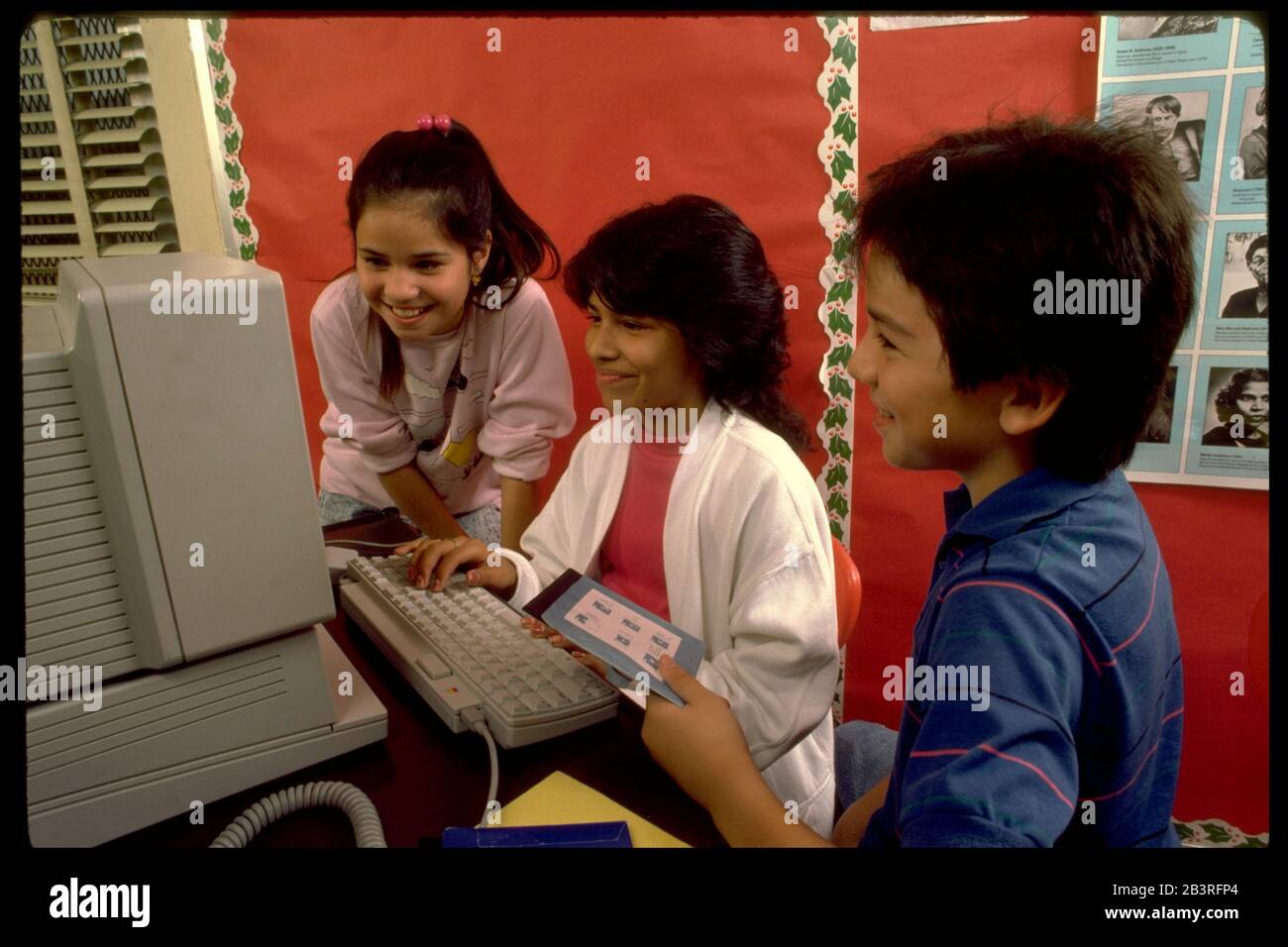 Austin Texas USA, circa 1992: Hispanic fifth grade students enjoy using ...