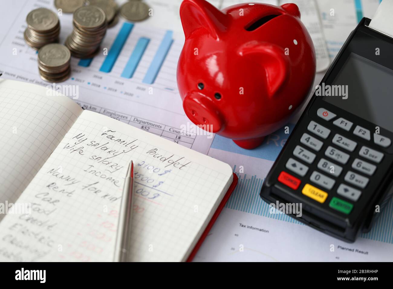 Graphs and diagrams on table Stock Photo - Alamy