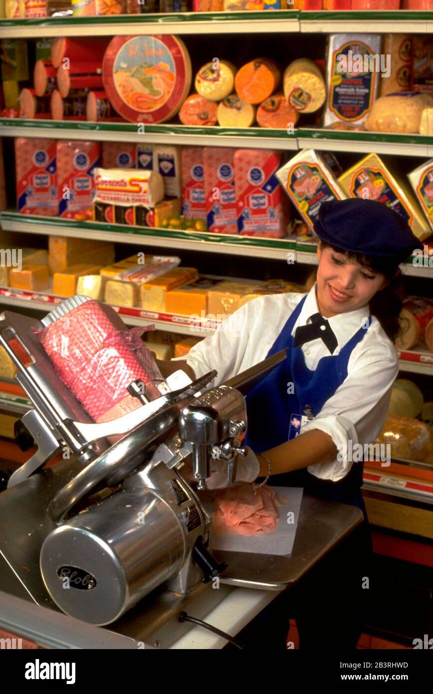 Austin Texas USA, circa 1992: Young female employee uses an electric ...