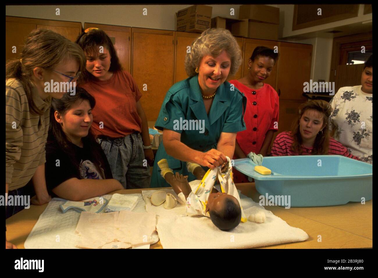 Austin Texas USA: Student in high school home economics class uses a ...