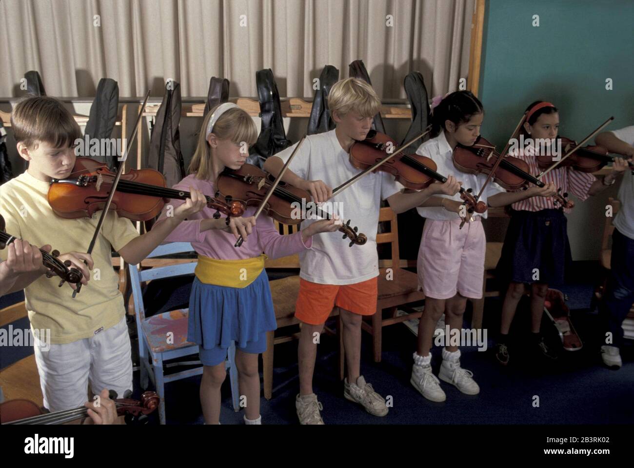 Children playing music orchestra hi-res stock photography and images ...