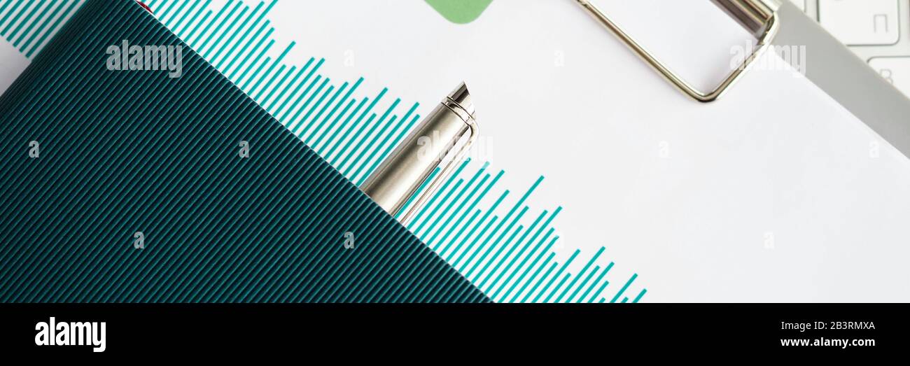 Chart financial report folder, notebook with pen Stock Photo - Alamy
