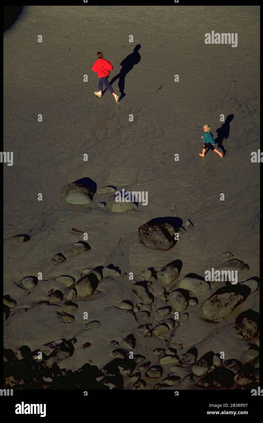Big Sur California USA: People jogging on the Pacific Coast beach at ...