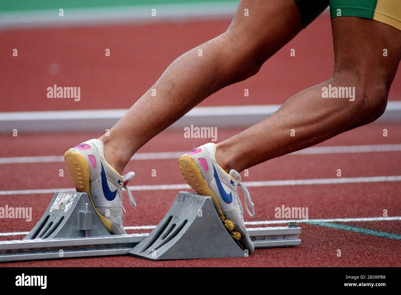 Austin, Texas USA, circa 1991: Male runner's feet in starting blocks at ...