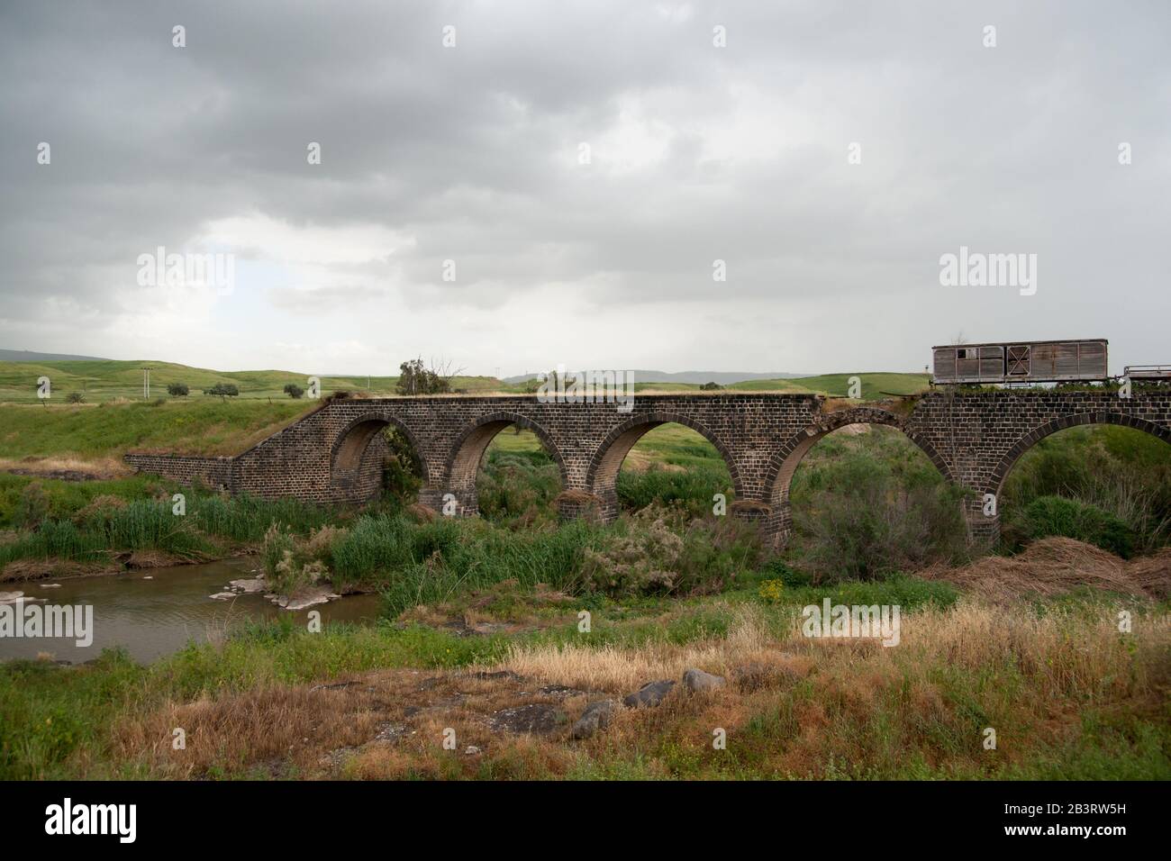 Israeli side of Jordan river ancient bridge Stock Photo - Alamy