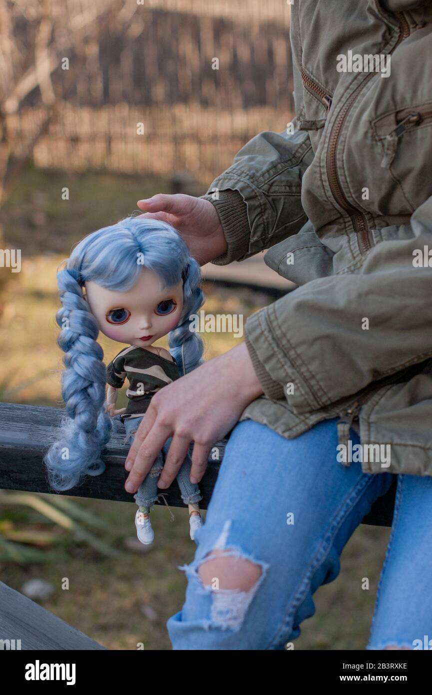 toddler girl with doll. Girl with a doll on a walk Stock Photo - Alamy