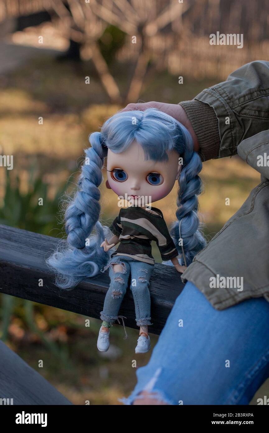 toddler girl with doll. Girl with a doll on a walk Stock Photo - Alamy