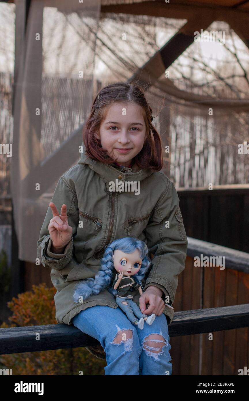 toddler girl with doll. Girl with a doll on a walk Stock Photo - Alamy