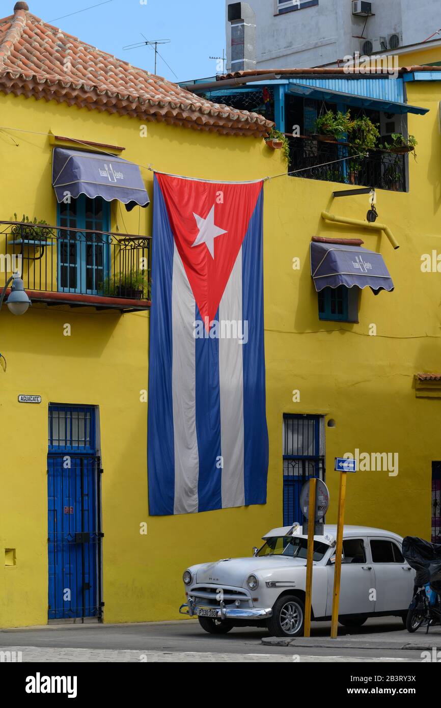 Cuban flag hanging outside a house, Havana, Cuba Stock Photo - Alamy