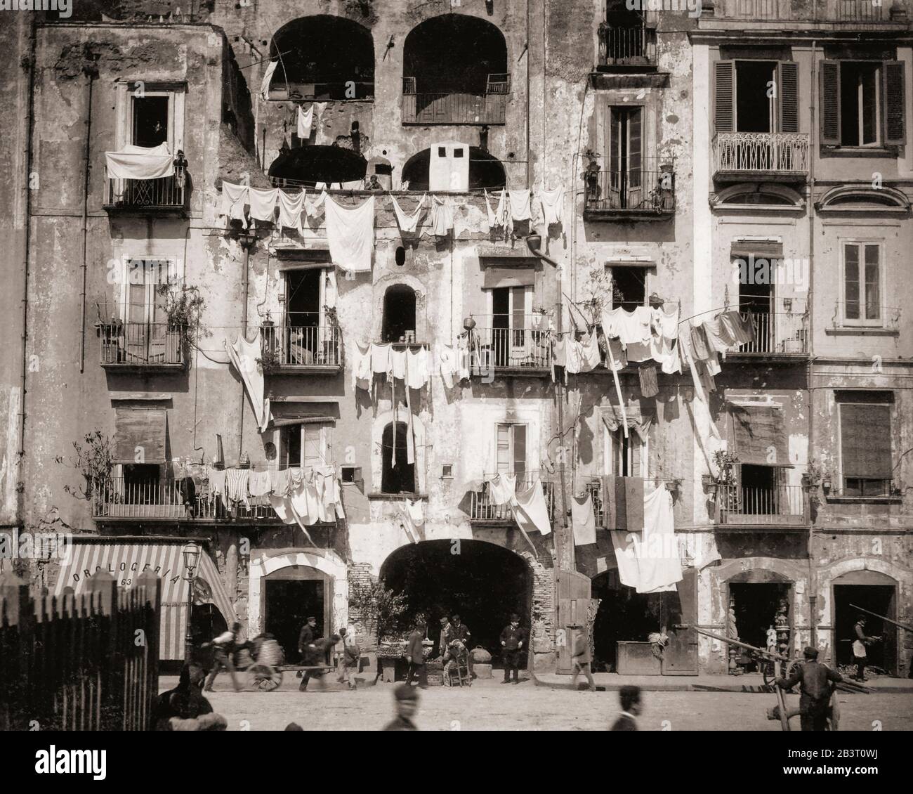 A street scene in Naples, Italy, in the late 19th century. After a work ...