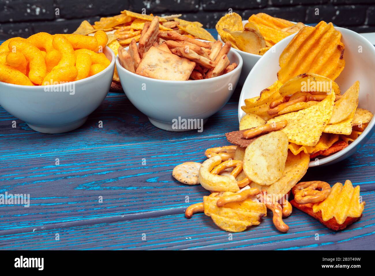 Differnt Types of Junk food, salty-sticks, salty-crackers on wooden ...