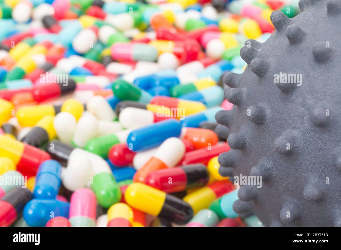 Colourful pills & model virus. For Coronavirus, Covid-19 in UK, SARS ...