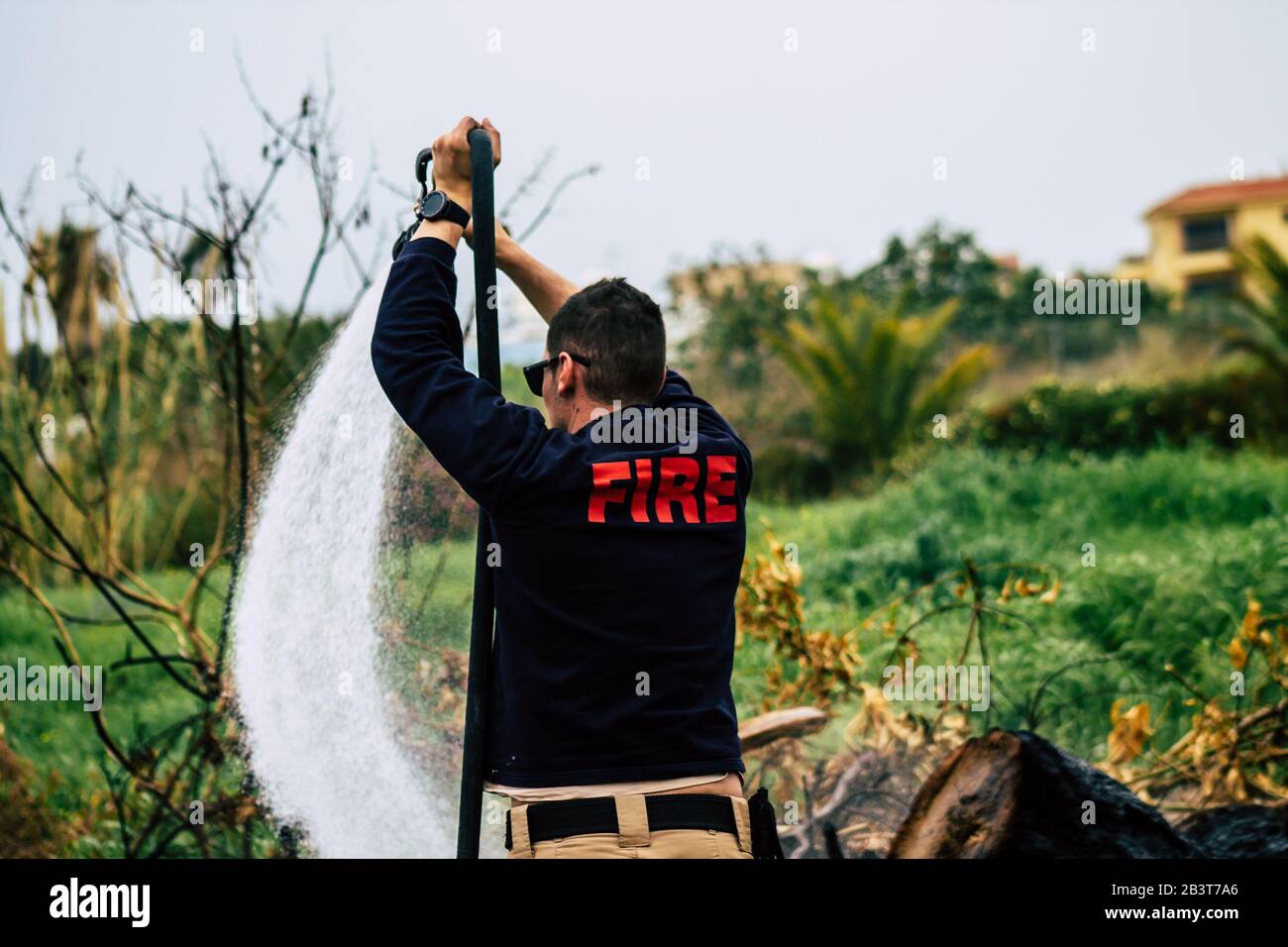 Paphos Cyprus March 04, 2020 View of a Cypriot firefighter putting out ...