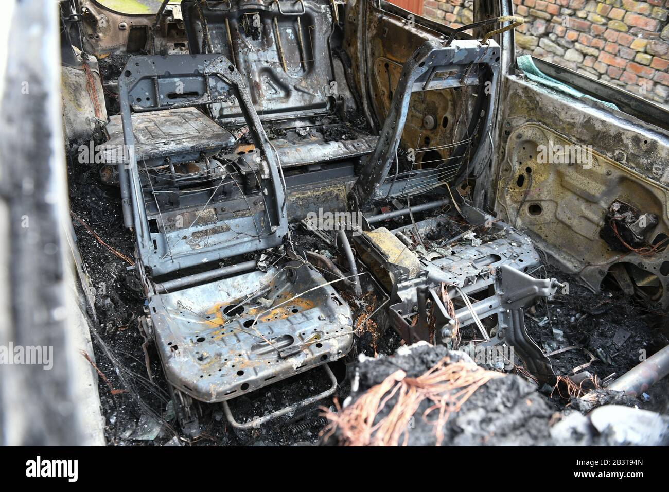The remains of the Ford which was set alight showing a black burnt ...
