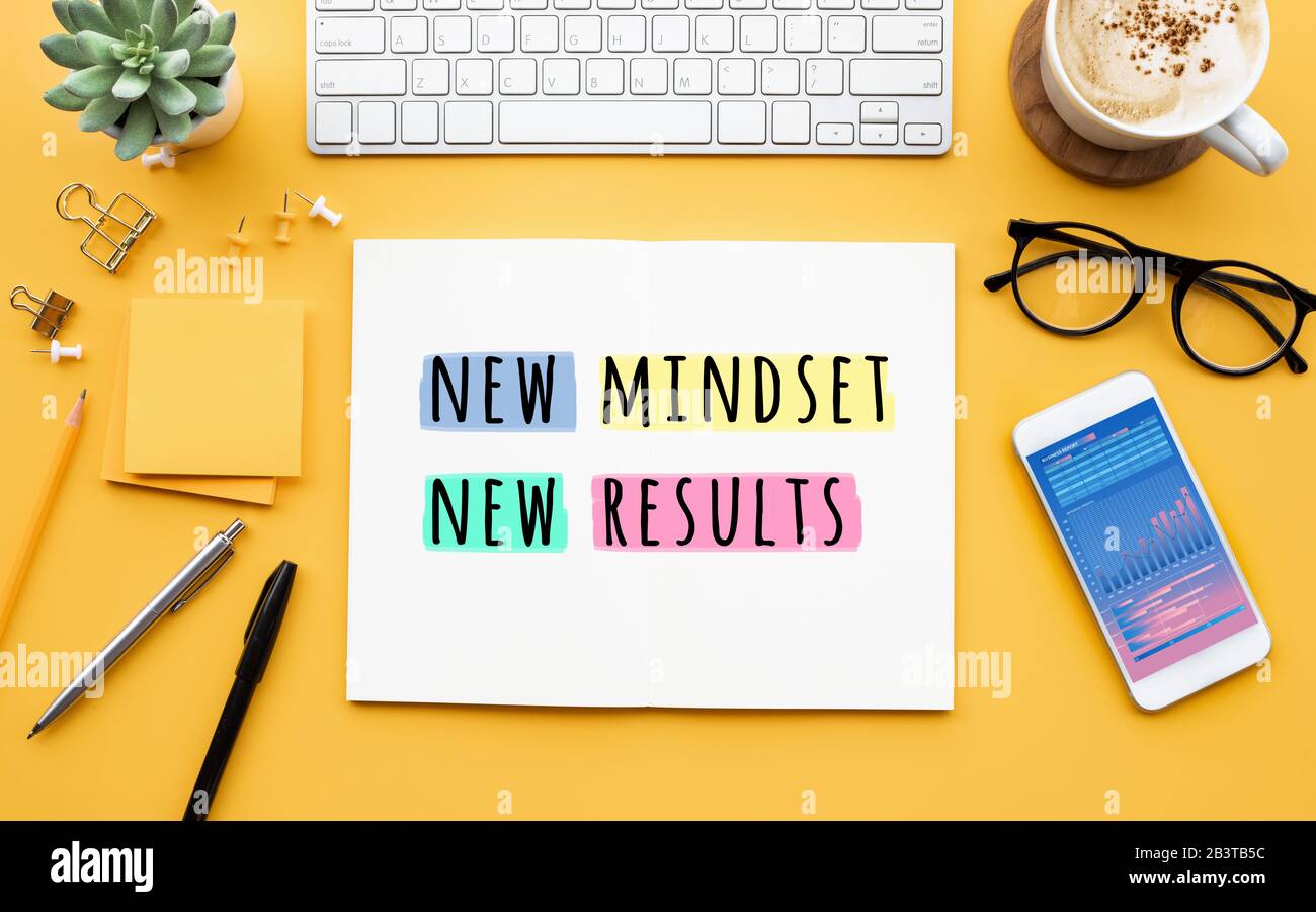 New mindset new results concepts with text on notepad on desk. positive ...