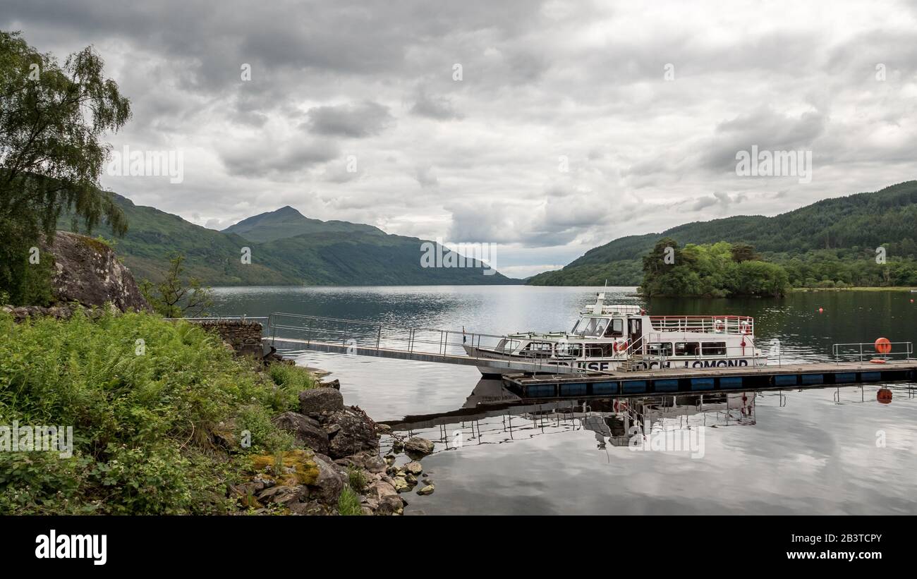 A tourist cruise ship on the banks of Loch Lomond in the heart of The ...