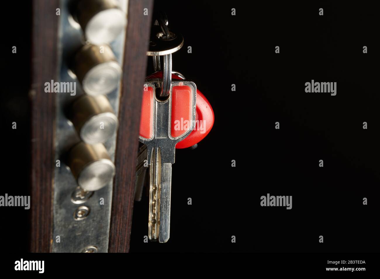the door lock with the handle and a key. Focus on keys Stock Photo - Alamy