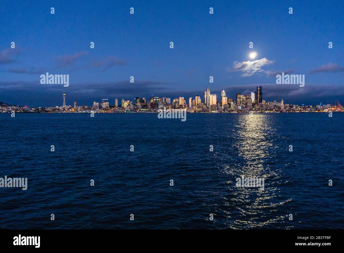 A bright full moon shines over the Seattle skyline Stock Photo - Alamy