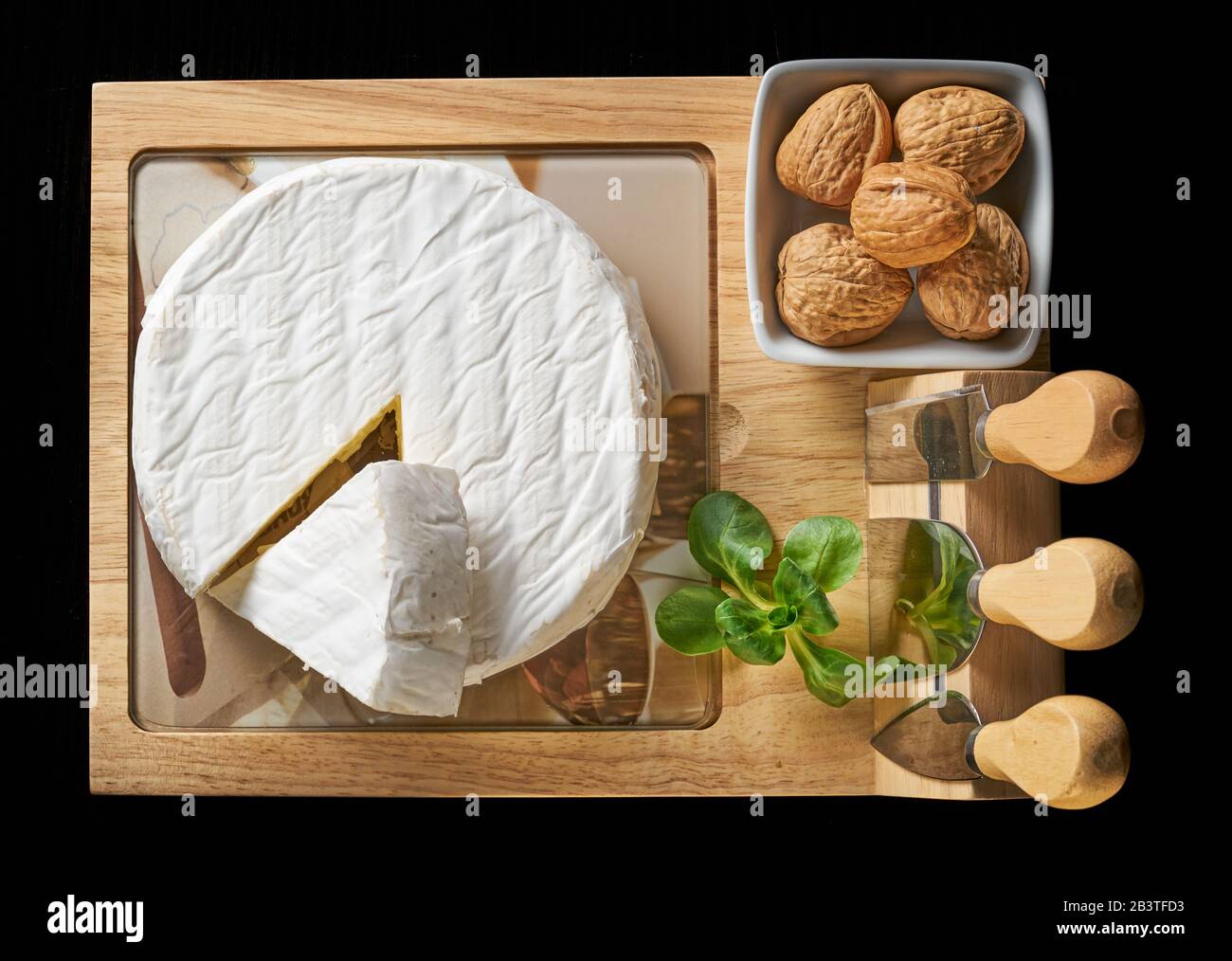 Round soft cheese, with a section cut Stock Photo - Alamy