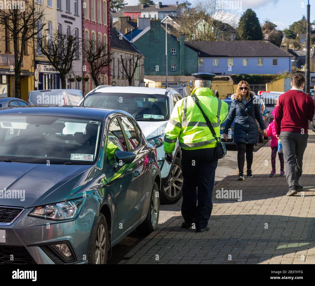 Traffic warden on patrol in Bandon, West Cork, Ireland Stock Photo - Alamy