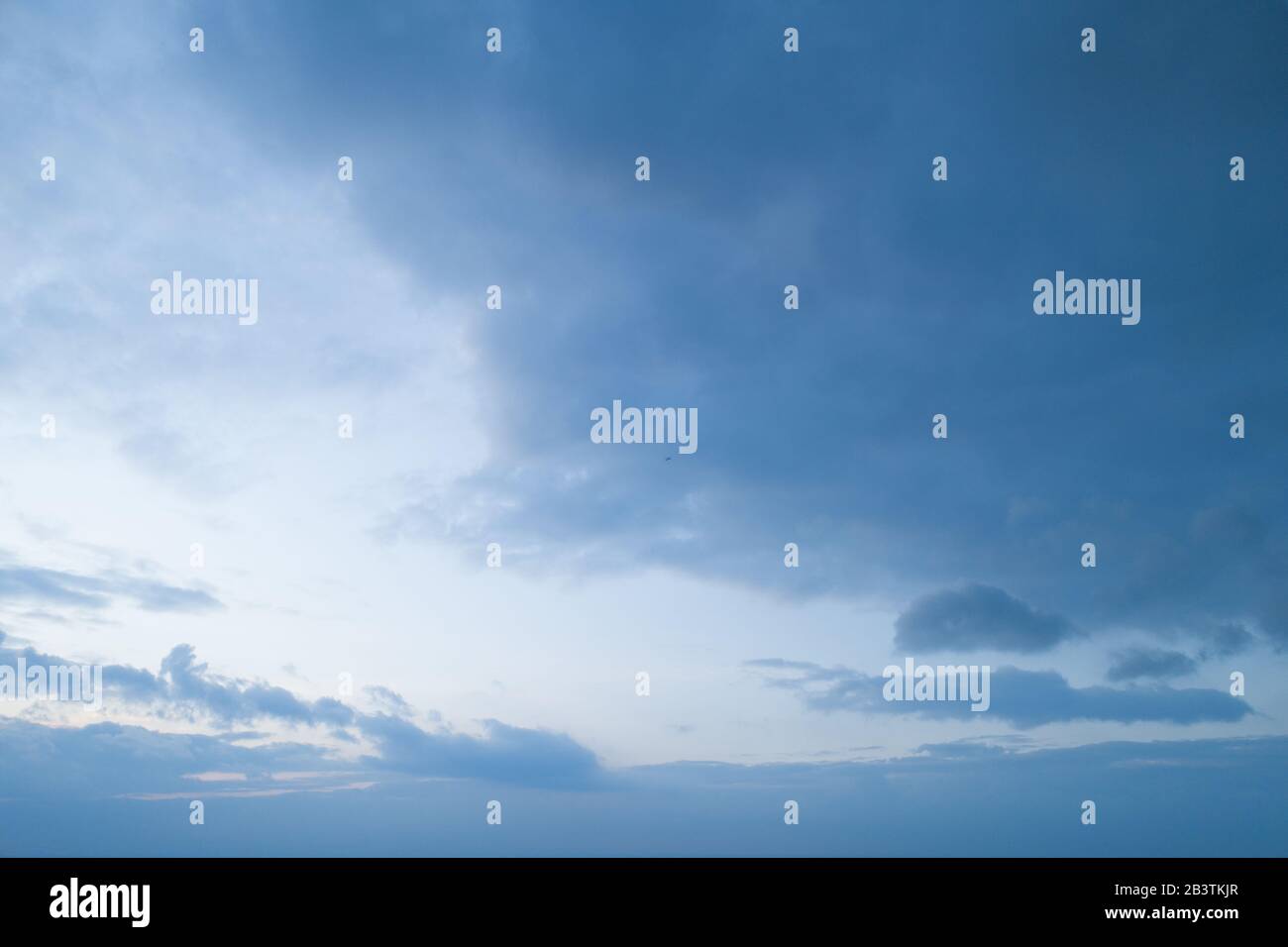 Beautiful sky with stretched clouds during twilight Stock Photo - Alamy