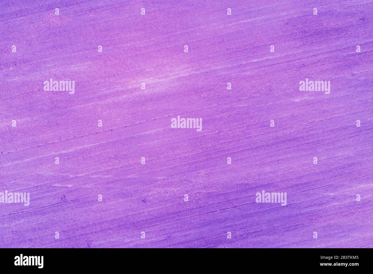 Soil texture background. Plowed field in early spring. Purple land ...