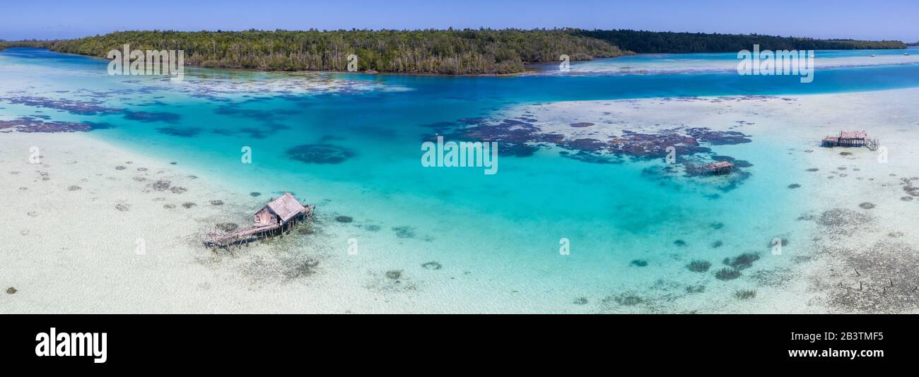 A bird's eye view shows a rustic Indonesian fishing village constructed ...