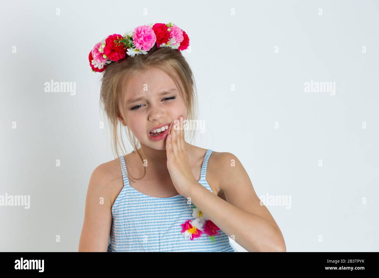 Closeup portrait girl, kid with sensitive tooth ache crown problem ...
