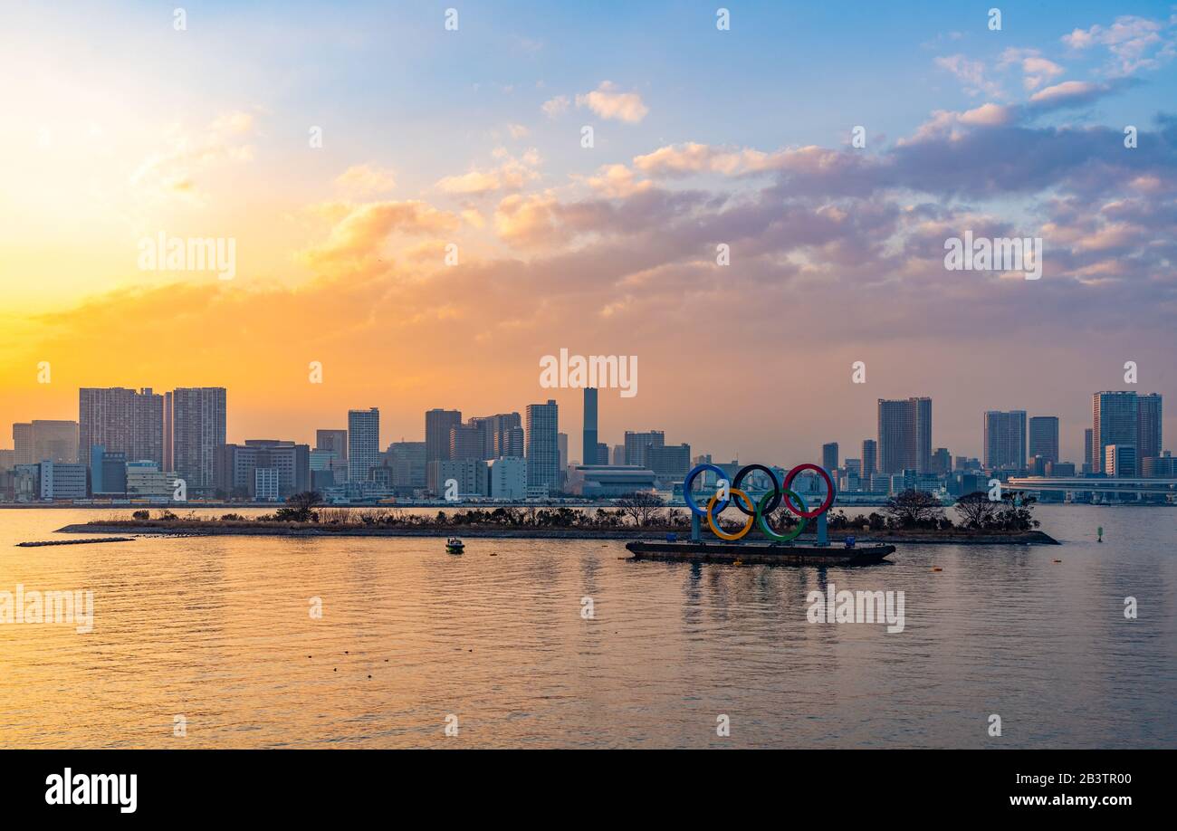 A picture of the Olympic Rings on display at the Tokyo Bay, at sunset ...