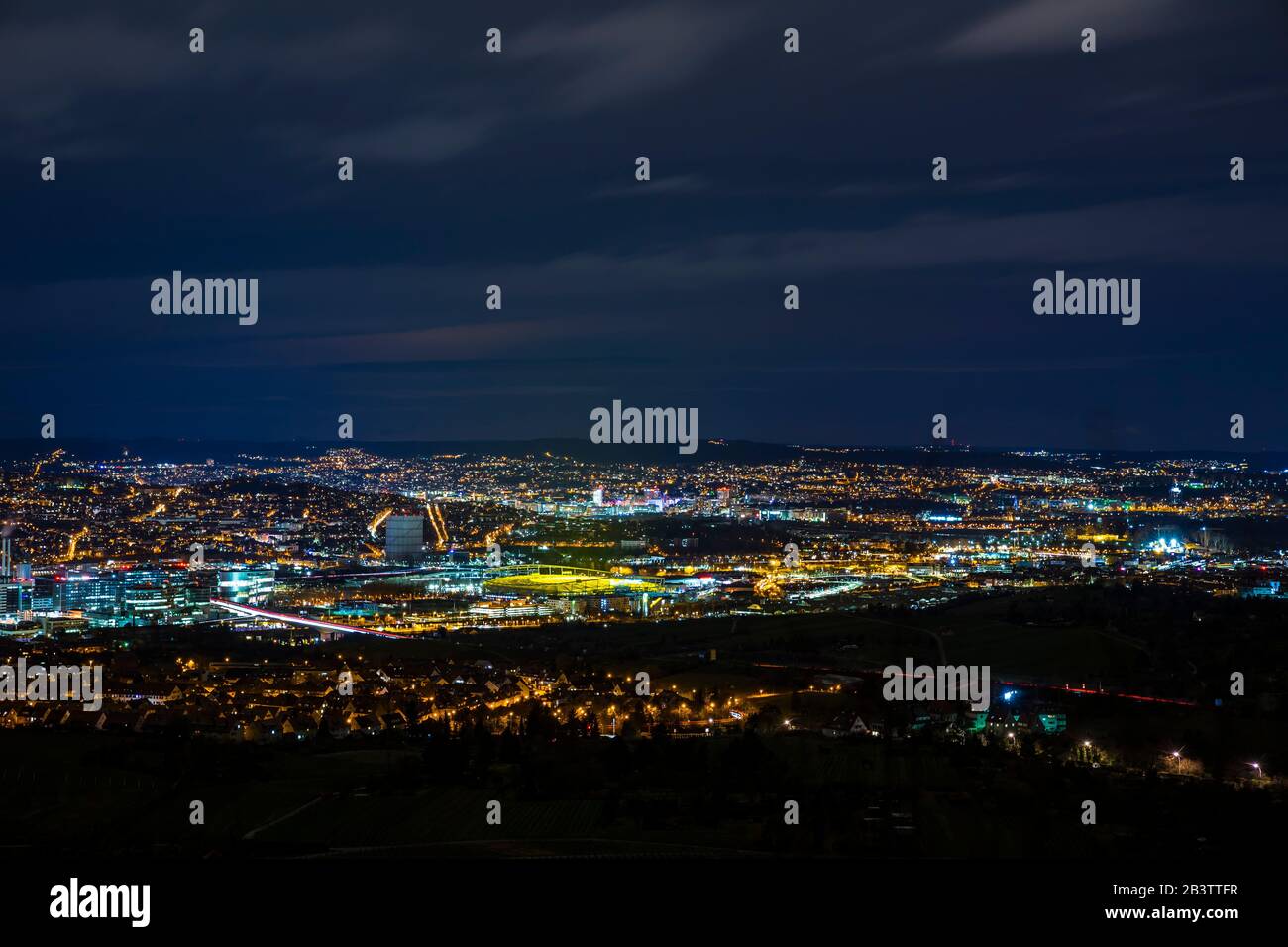 Germany, Magical illuminated skyline of stuttgart city, arena, industry ...