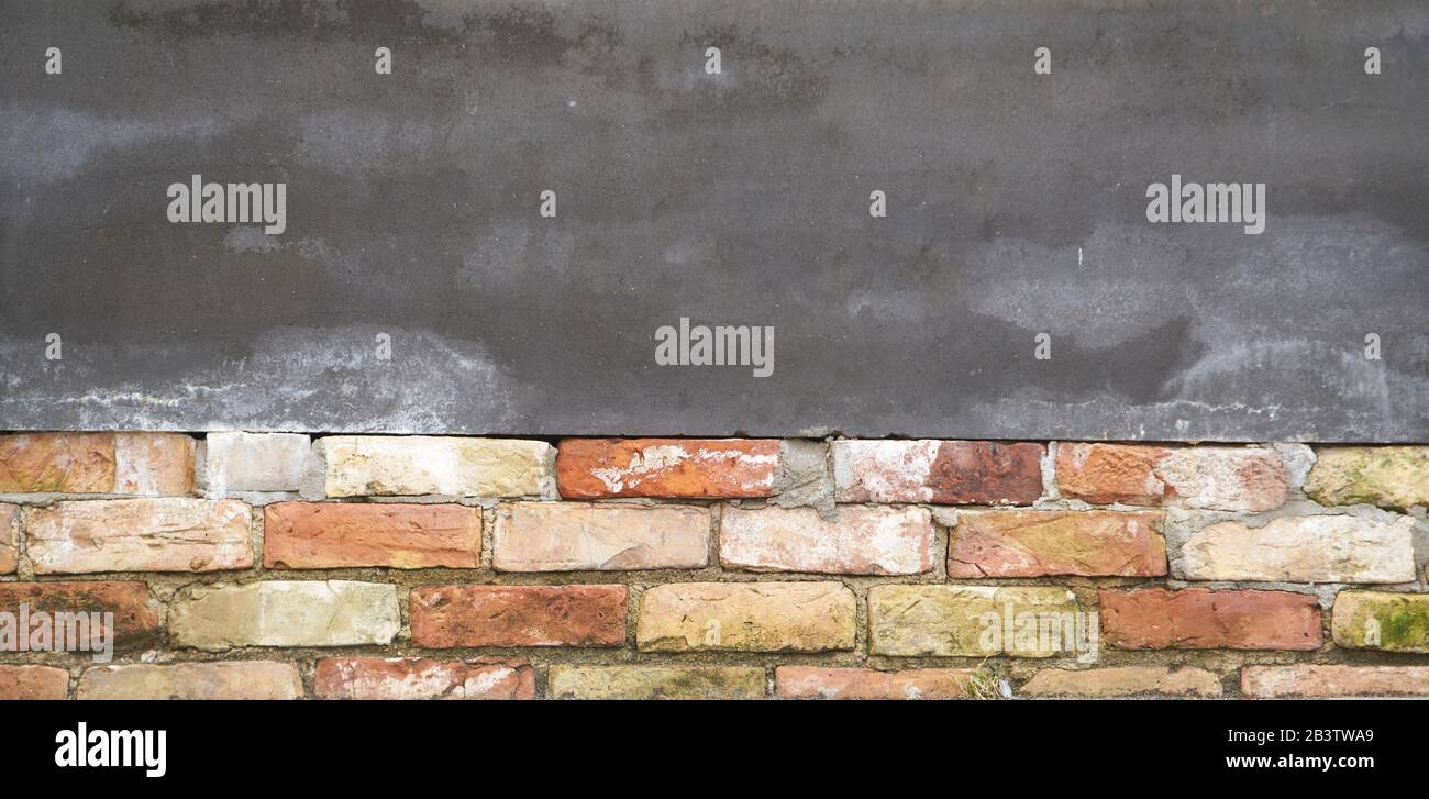 A Blank Gray Sign For Your Text On A Red Brick Wall Stock Photo - Alamy