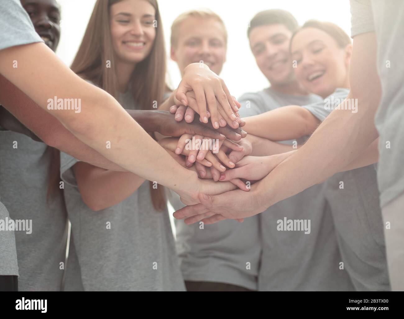 close up. tower from the hands of a young team Stock Photo - Alamy