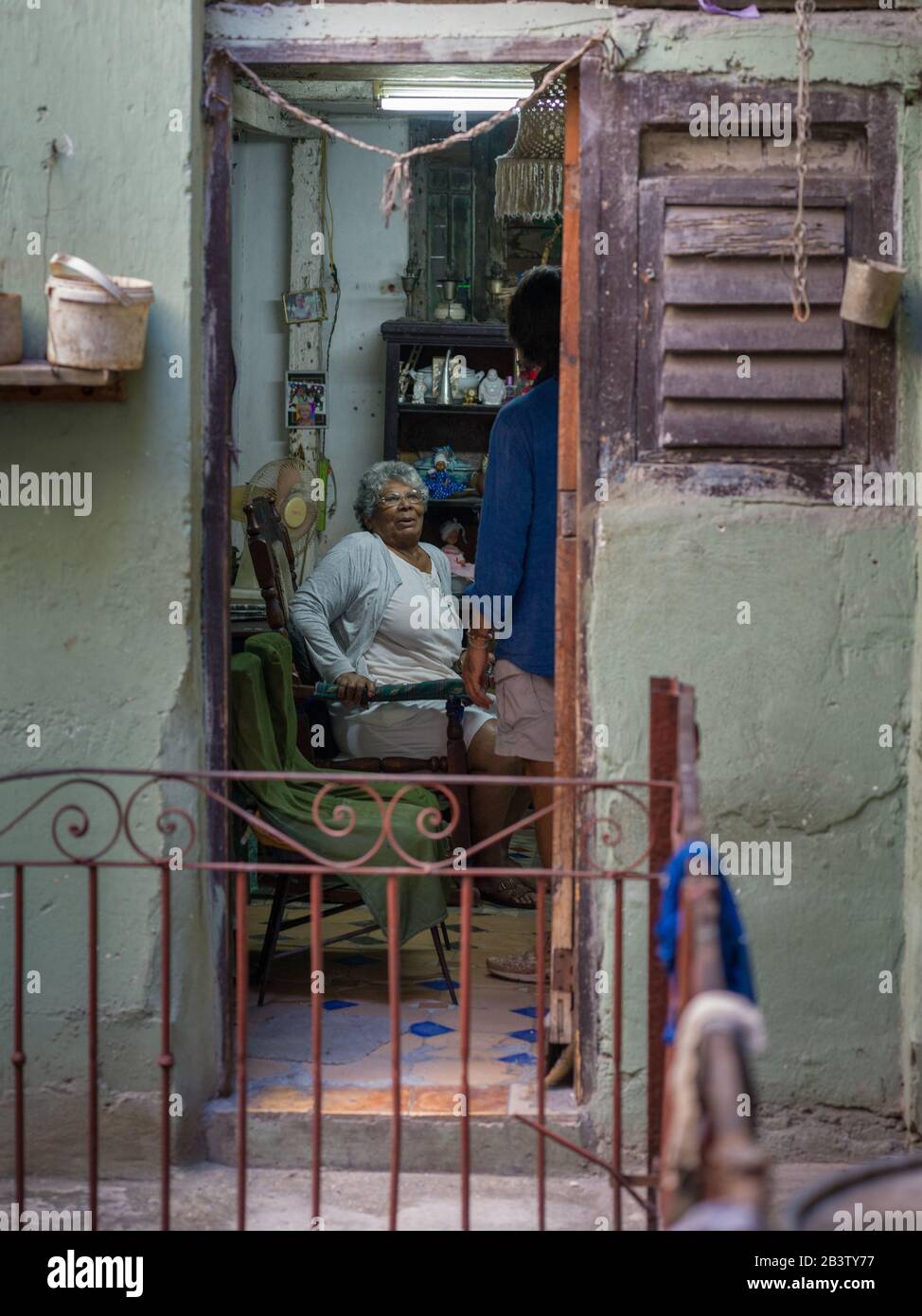 Two people inside a house, Havana, Cuba Stock Photo - Alamy