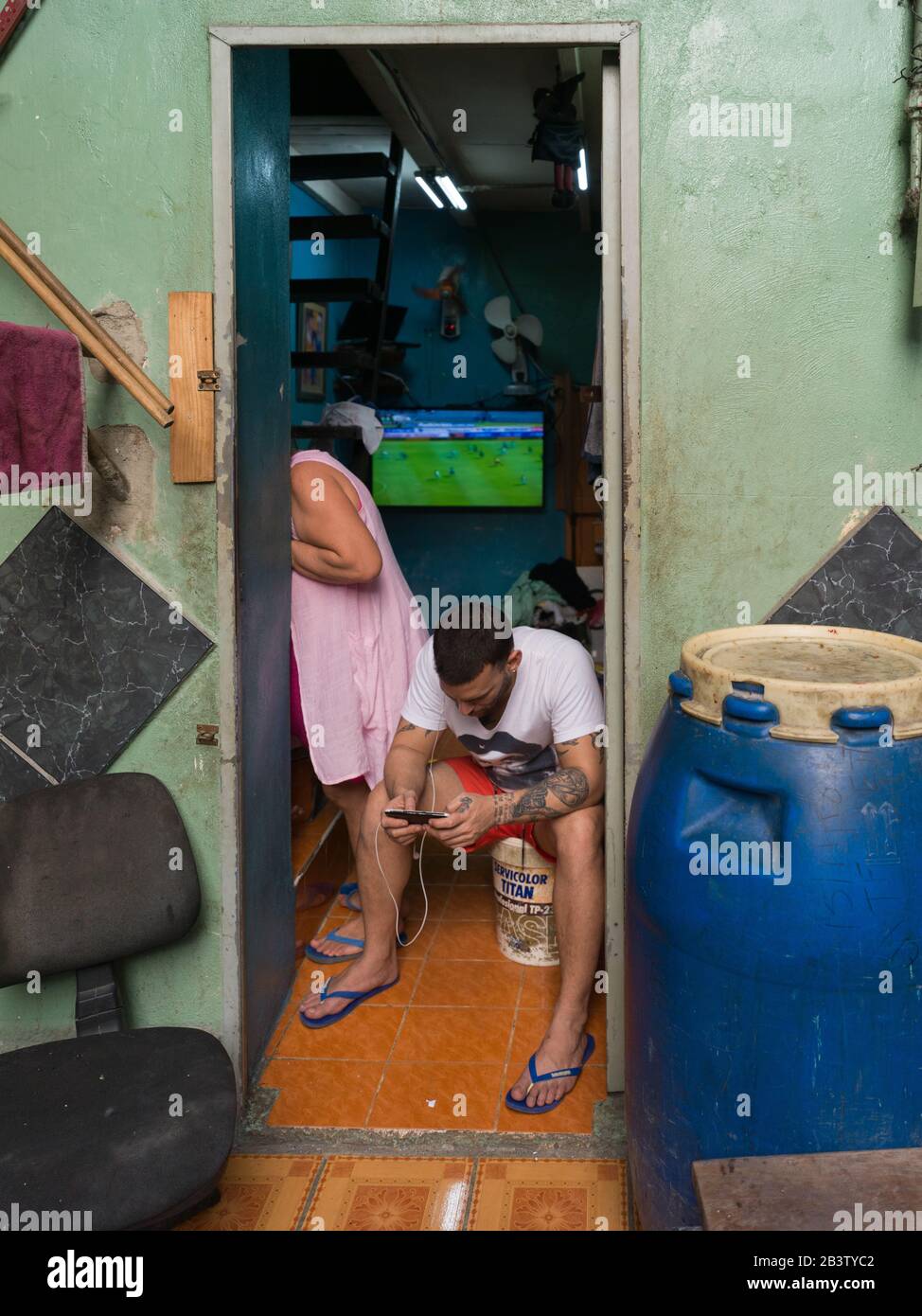Two people inside a house, Havana, Cuba Stock Photo - Alamy