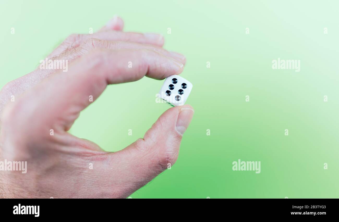 Dice hand hi-res stock photography and images - Alamy