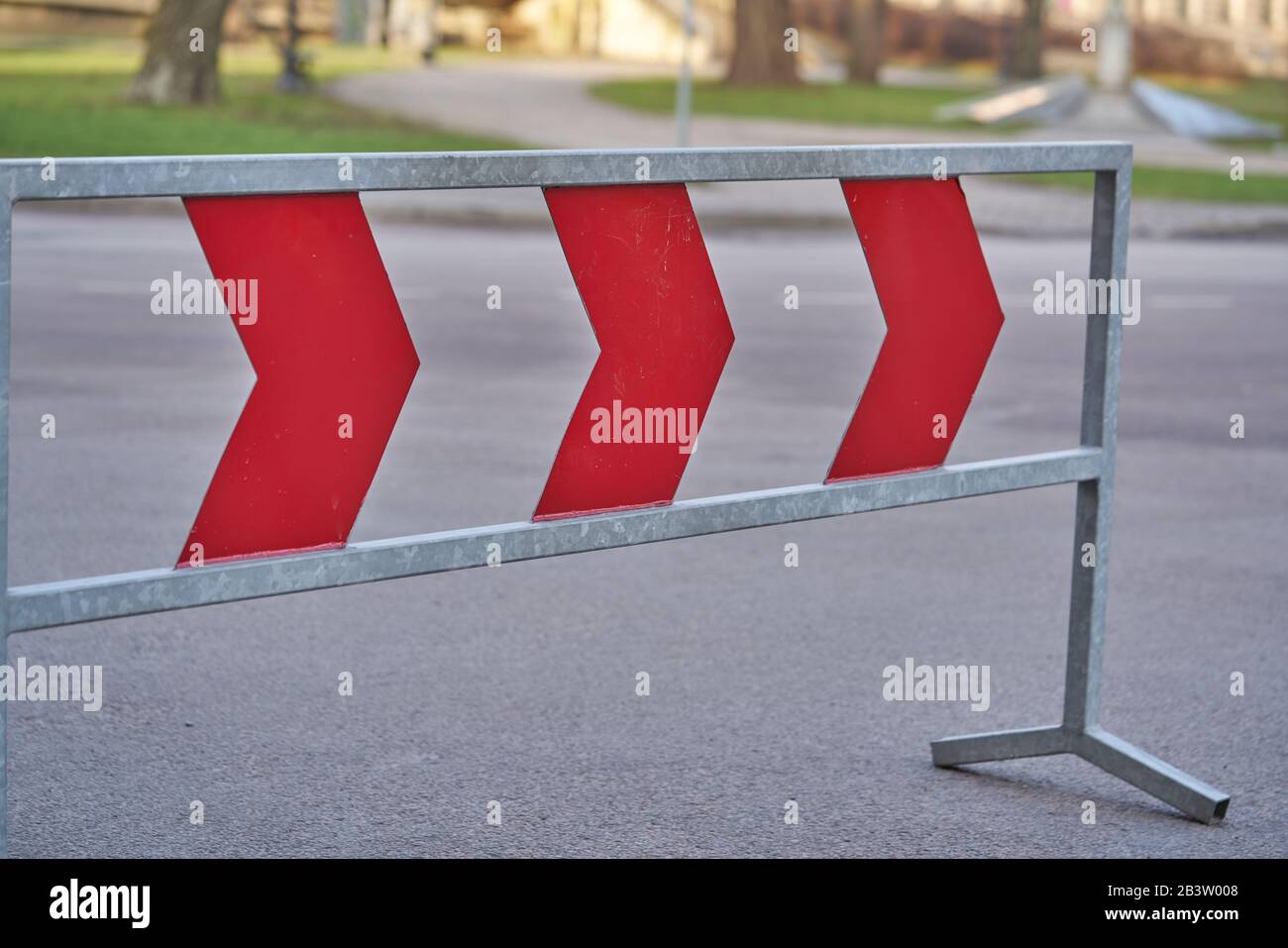 Asphalt road with chevron road signs Stock Photo - Alamy