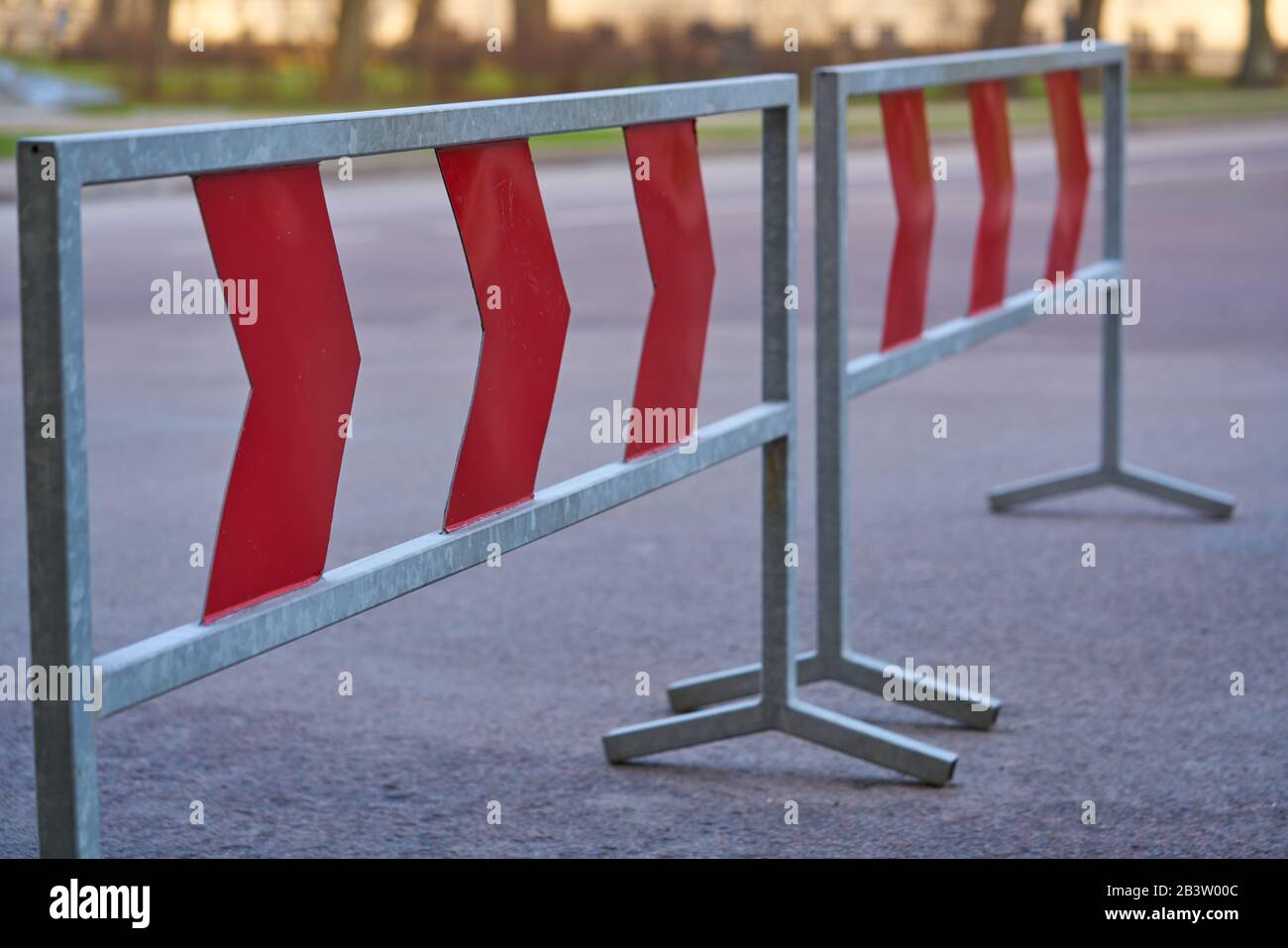 Asphalt road with chevron road signs Stock Photo - Alamy