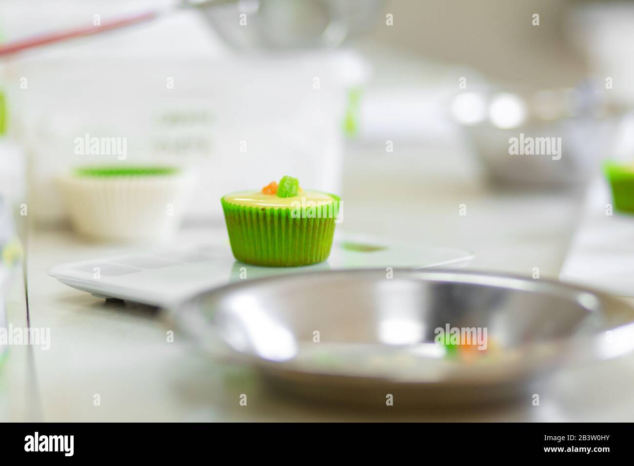 The process of making cupcakes. Creation of cakes by professional ...