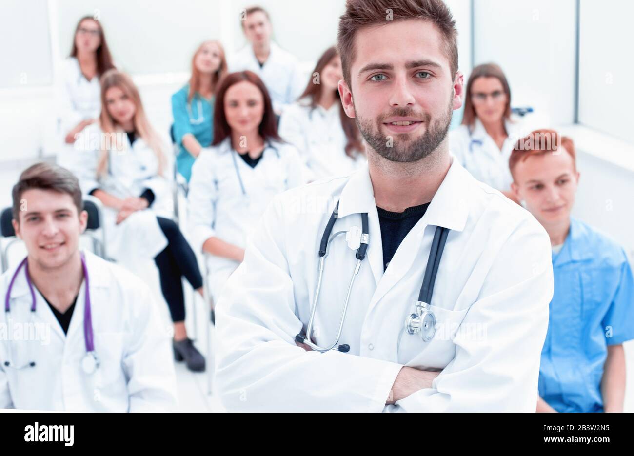 top view. a group of smiling doctors pointing at you Stock Photo - Alamy