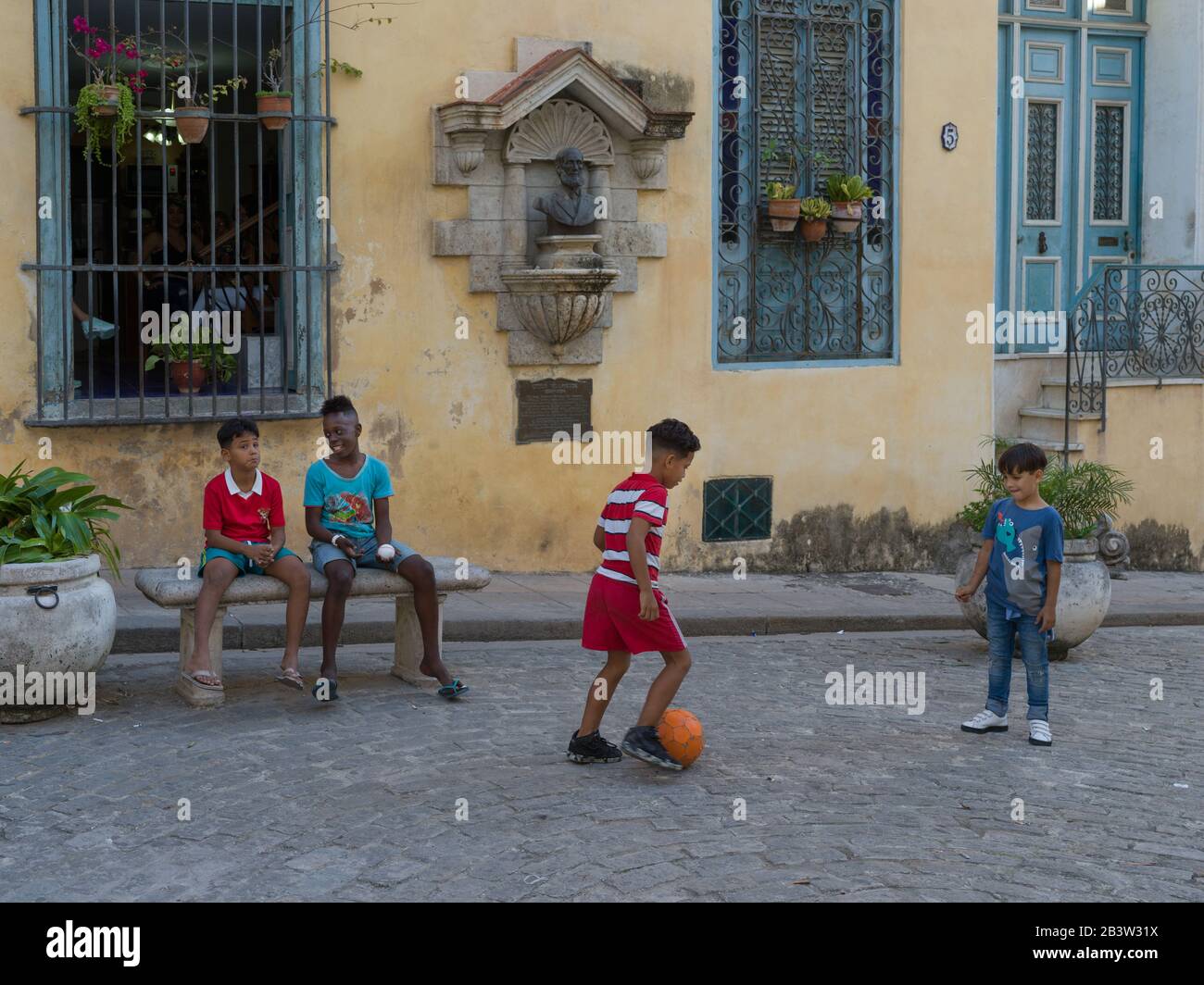 Children playing with a ball on street, Havana, Cuba Stock Photo - Alamy